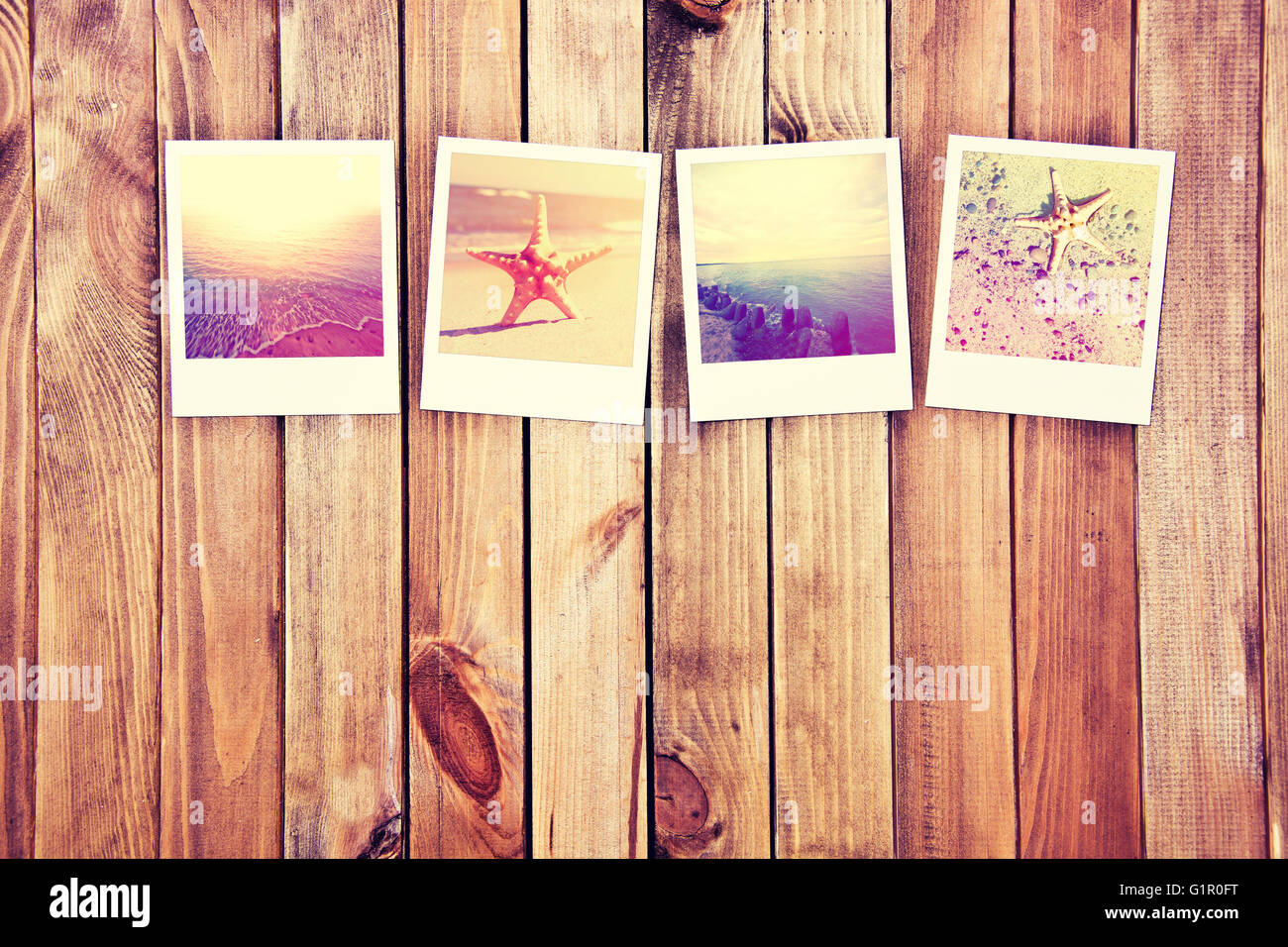 Great memory from vacation. Instant photos frames on wooden background ...