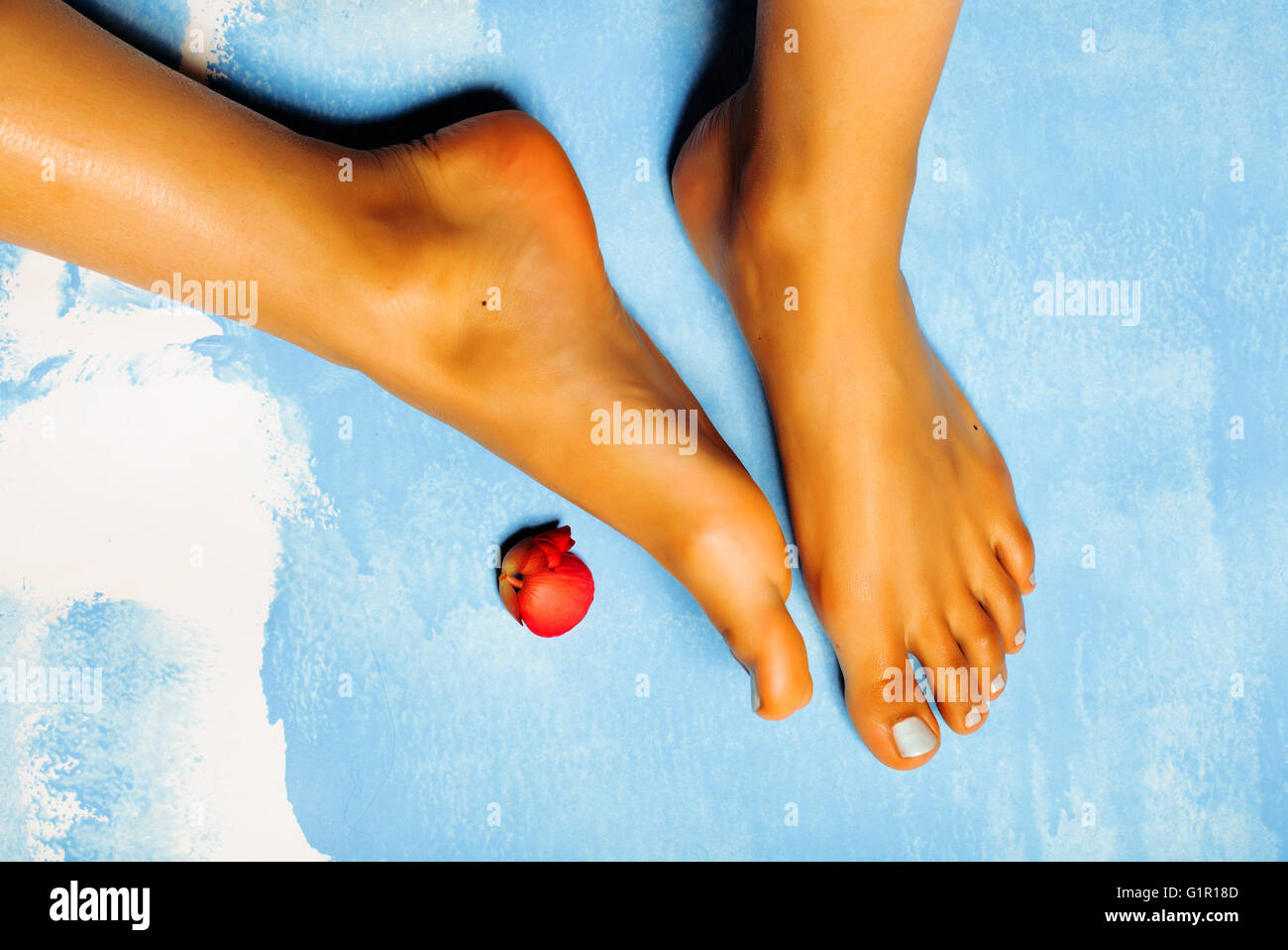 stylish african Female perfect shape feet, blue pedicure with pink ...