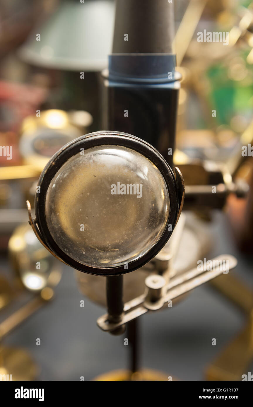 large convex lens magnifying old glass impurities and distorting the ...