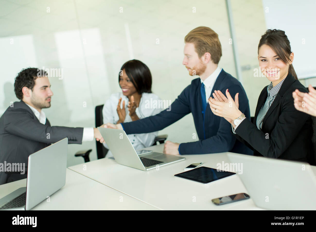 Business people shaking hands in the office Stock Photo - Alamy