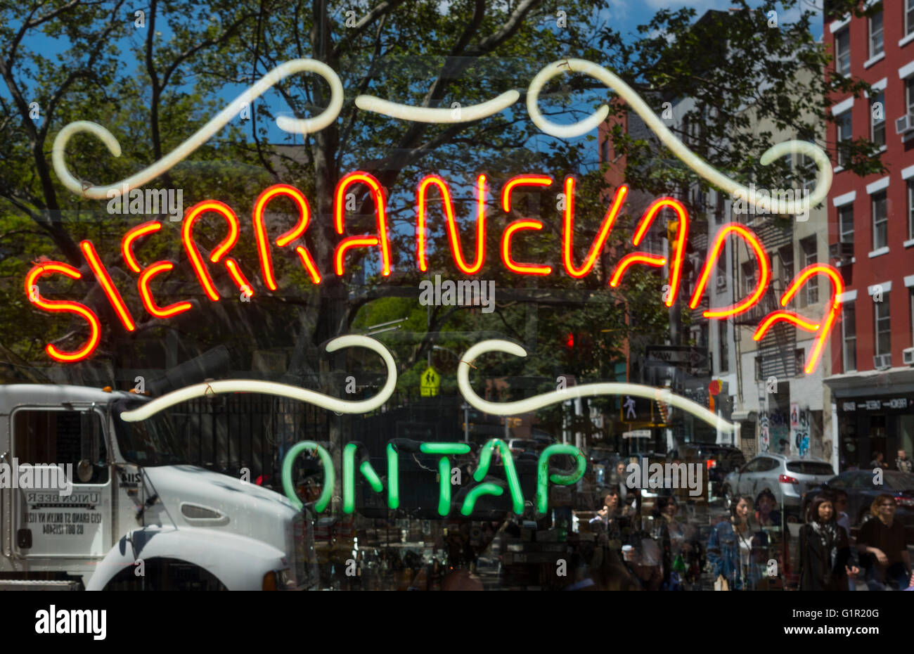 Neon Sierra Nevada on tap sign in a bar window in New York City Stock ...