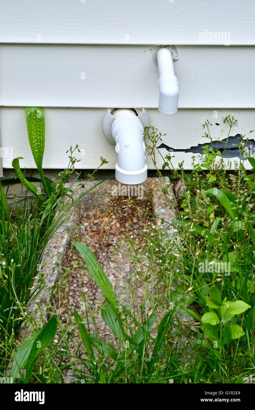 A residential home with a drain pipe on the exterior Stock Photo - Alamy