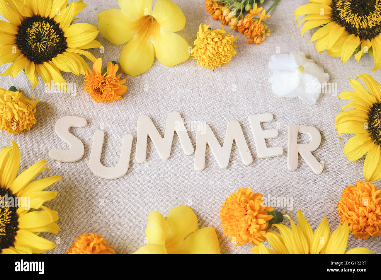 Yellow flowers and summer word background Stock Photo - Alamy