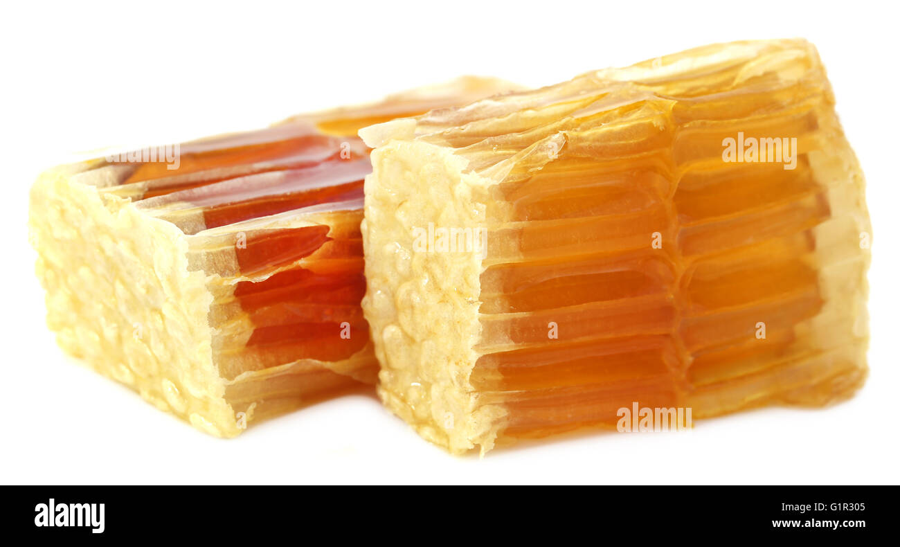 Honey comb over white background Stock Photo - Alamy