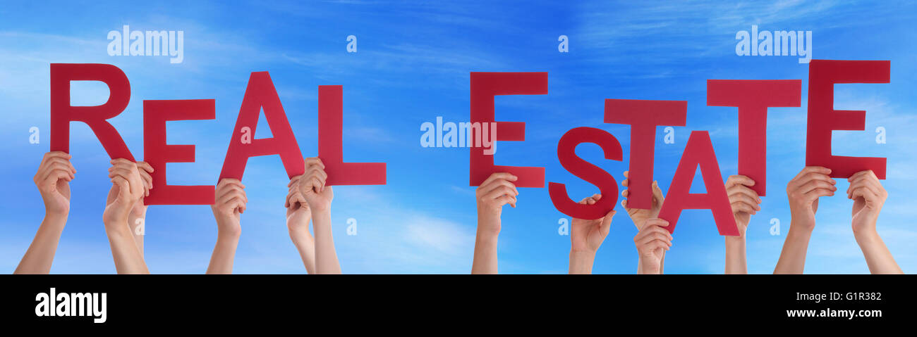 People Hands Holding Red Word Real Estate Blue Sky Stock Photo - Alamy