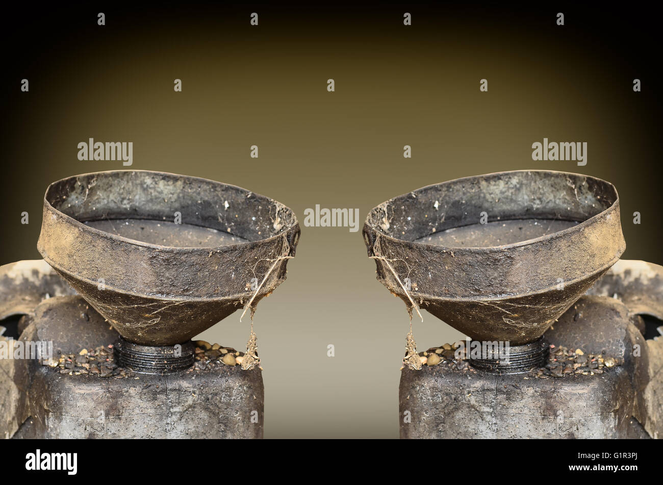Two Old Oil funnel on vintage background Stock Photo - Alamy
