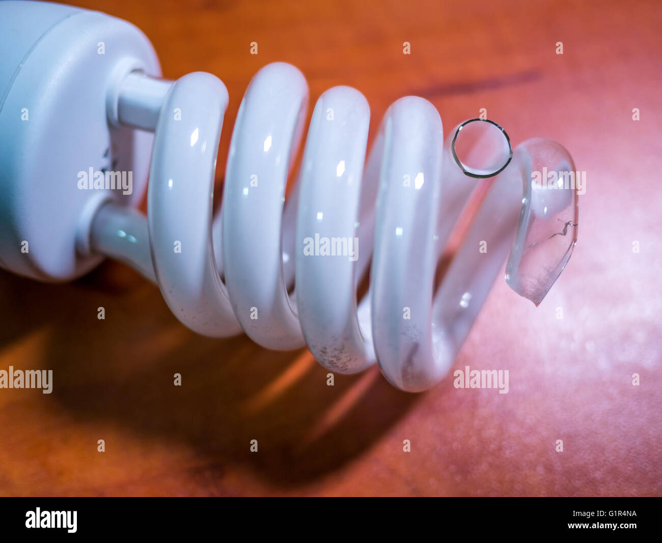 broken bulb light over brown background, shadow Stock Photo - Alamy
