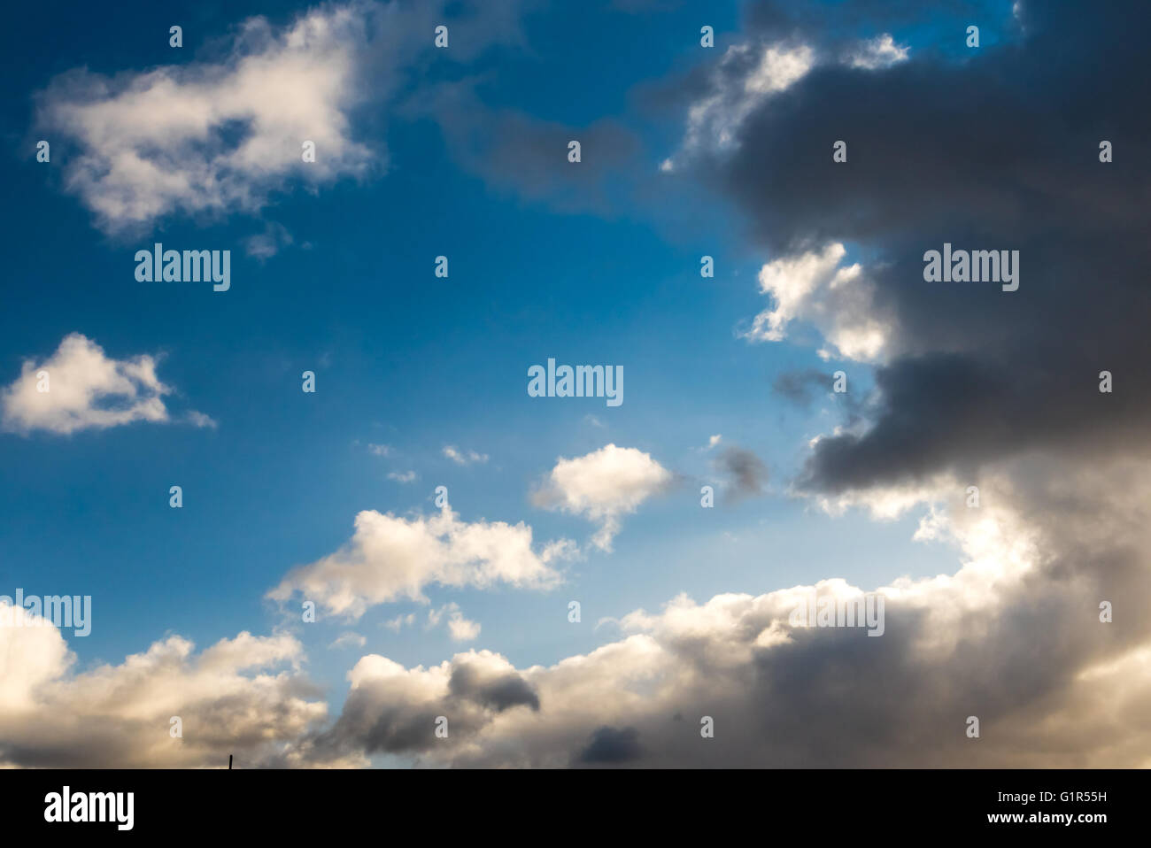 Blue sky with clouds and sun scape Stock Photo - Alamy
