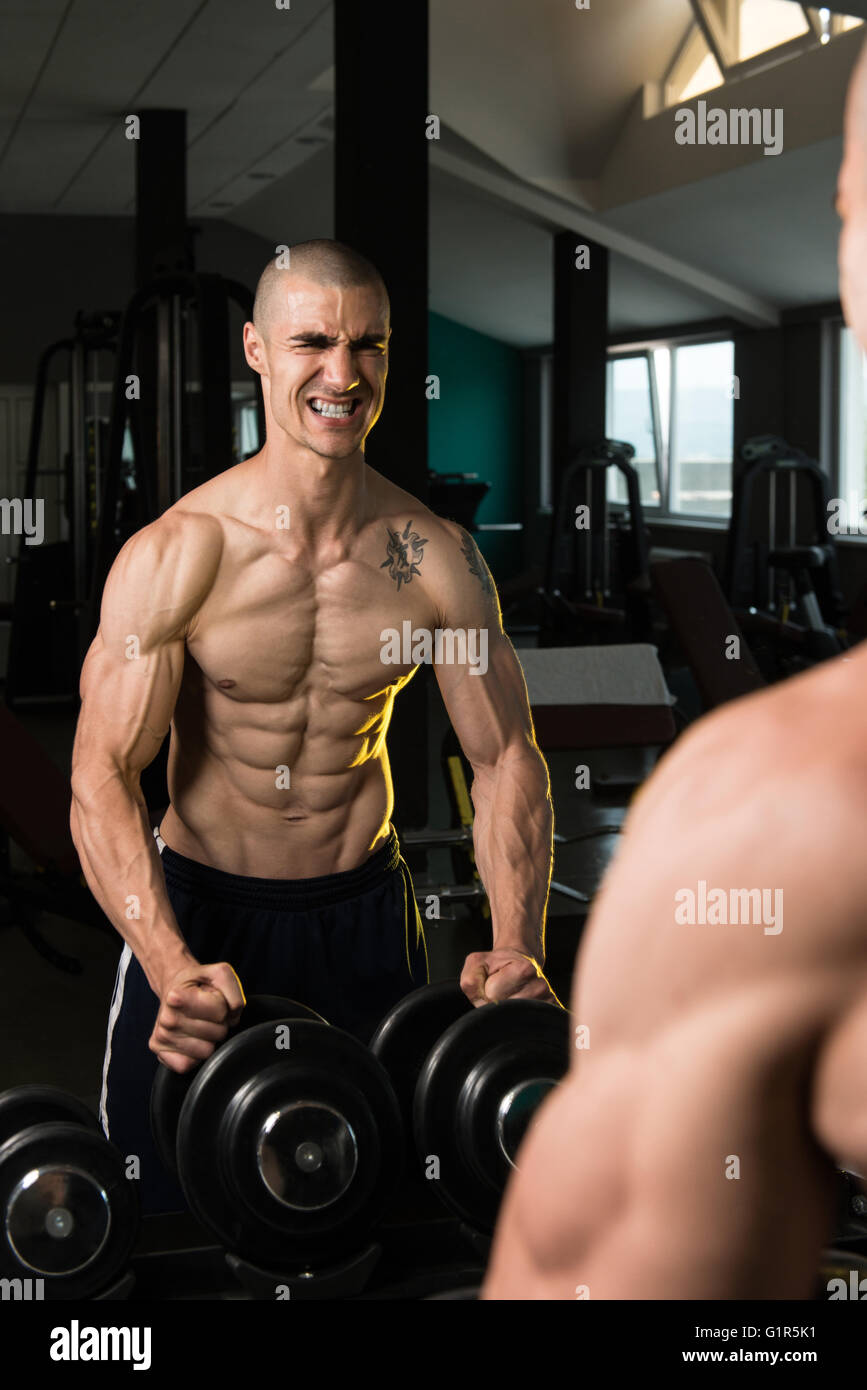 Young fit man posing mirror hi-res stock photography and images - Alamy