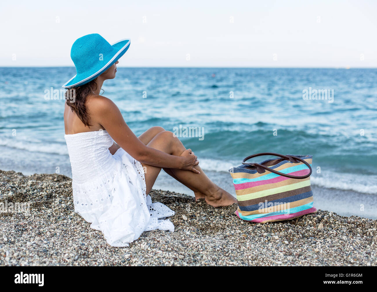 Woman relaxing at the seaside Stock Photo - Alamy
