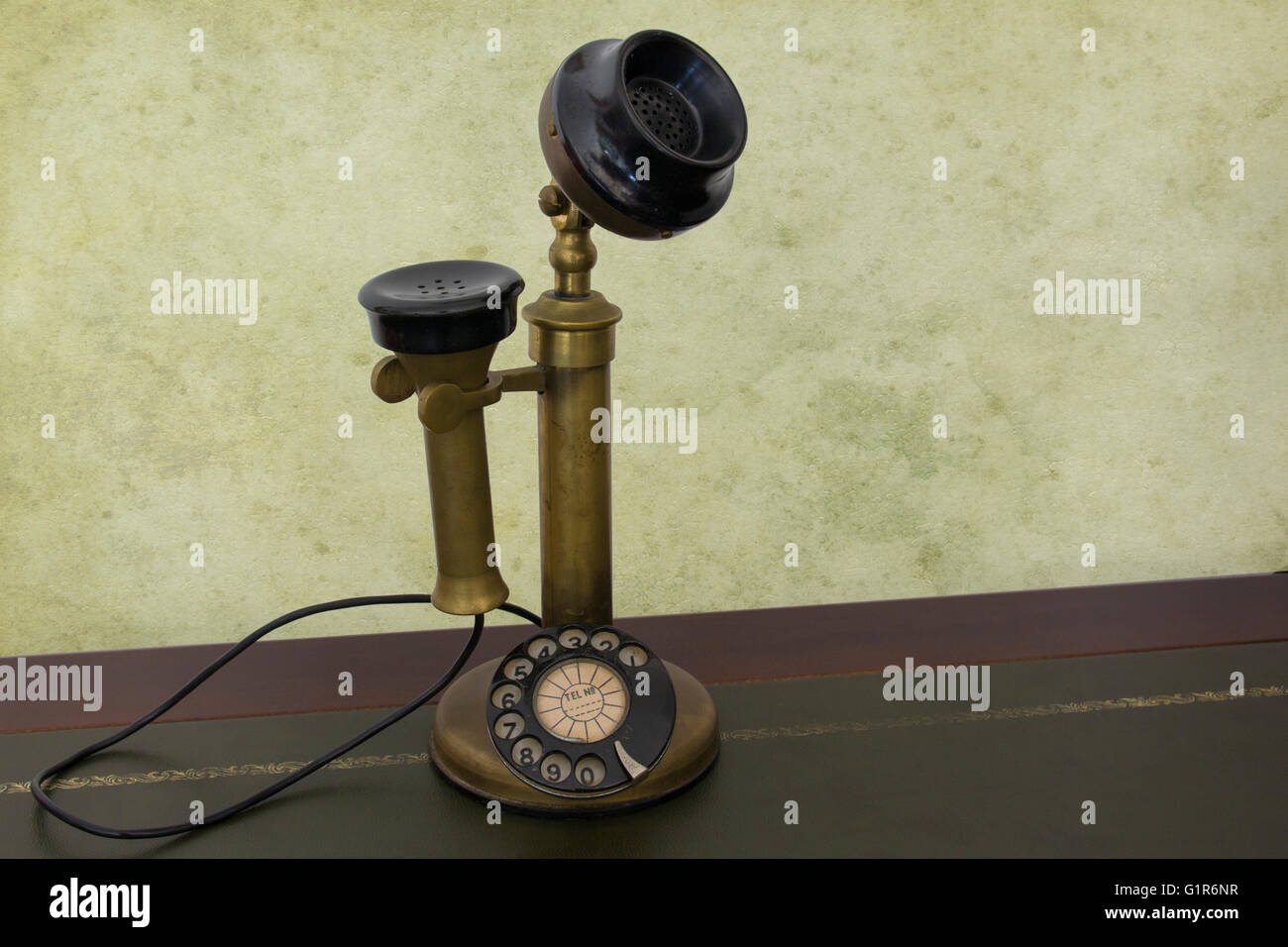 Antique phone with control dial, old rotary telephone Stock Photo - Alamy