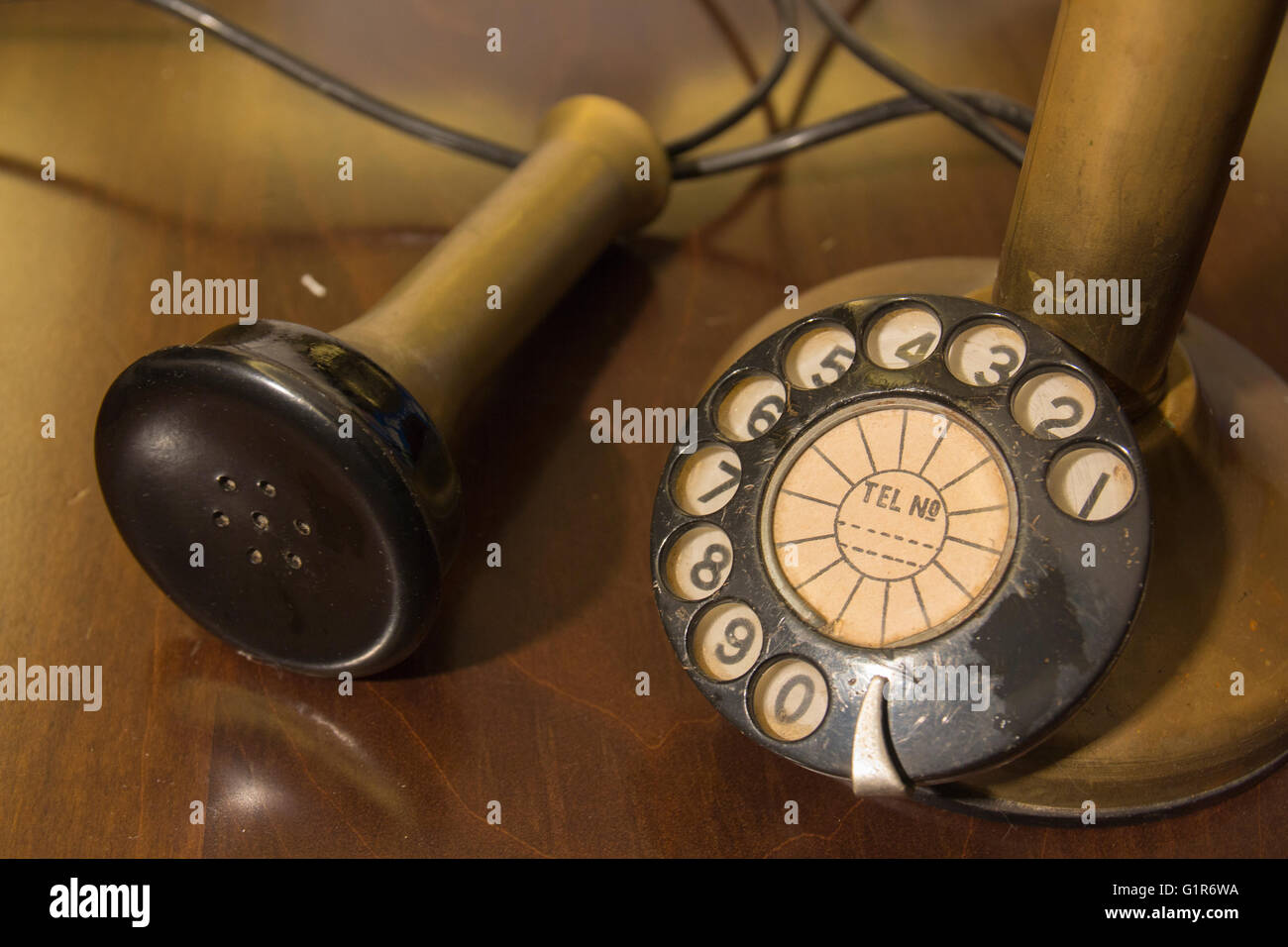 Antique phone with control dial, old phone Stock Photo - Alamy