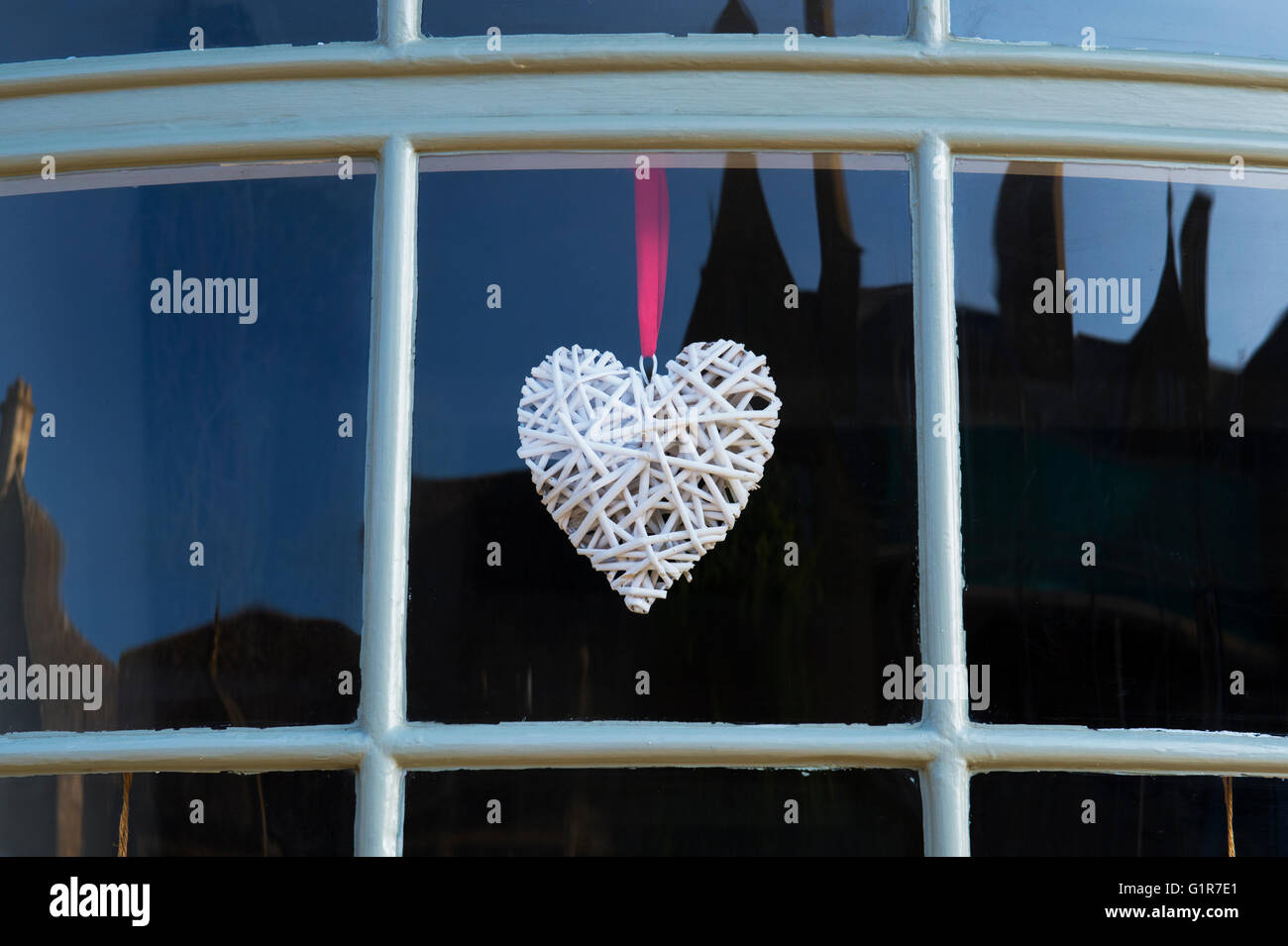 Heart hanging in in a broadway shop window. Cotswolds, England Stock ...