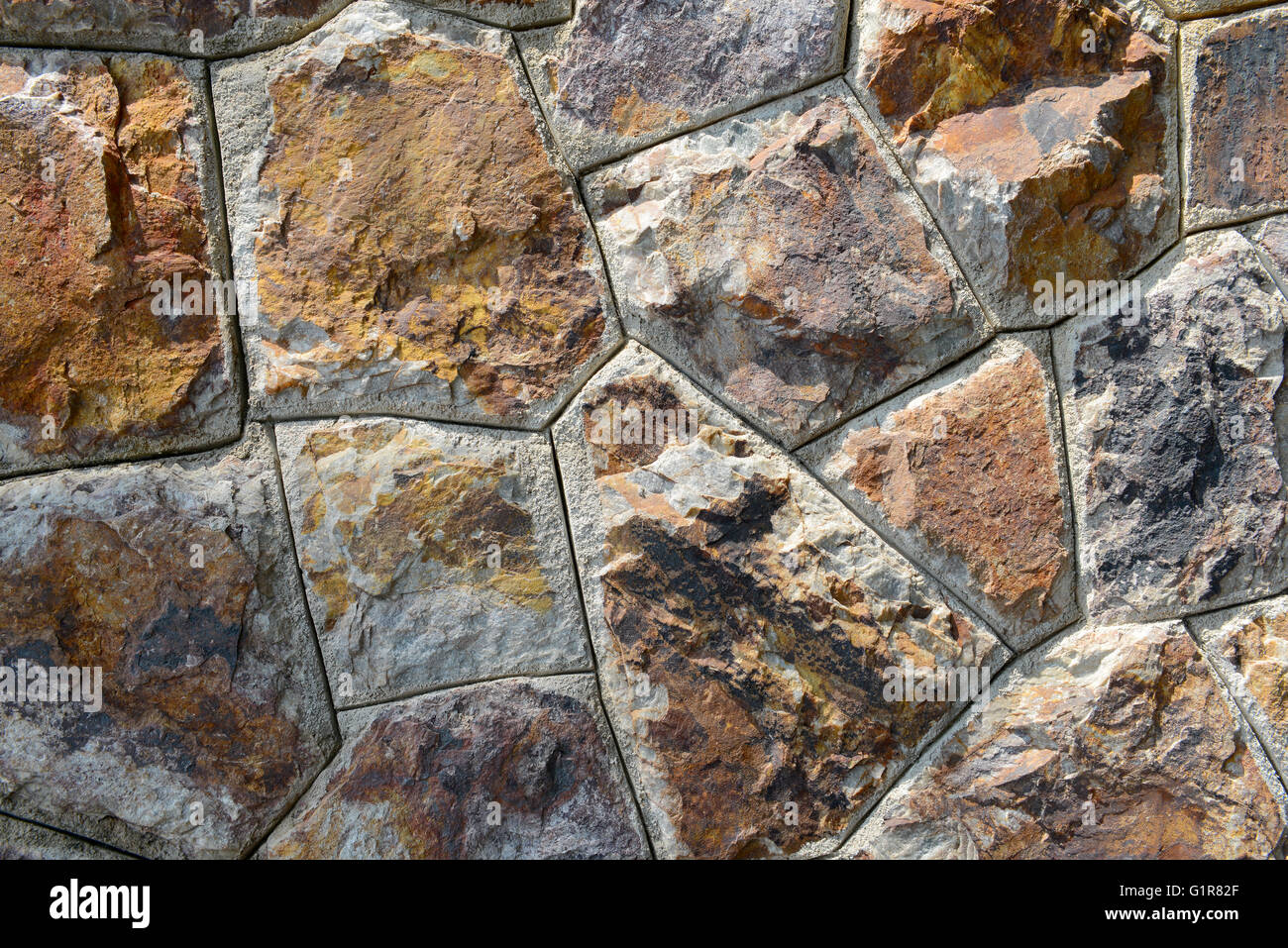 Brown stone wall texture and background Stock Photo - Alamy