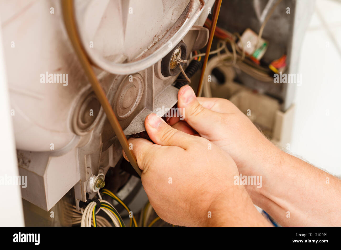 Domestic mechanical industrial concept. Mechanic repairing washing ...