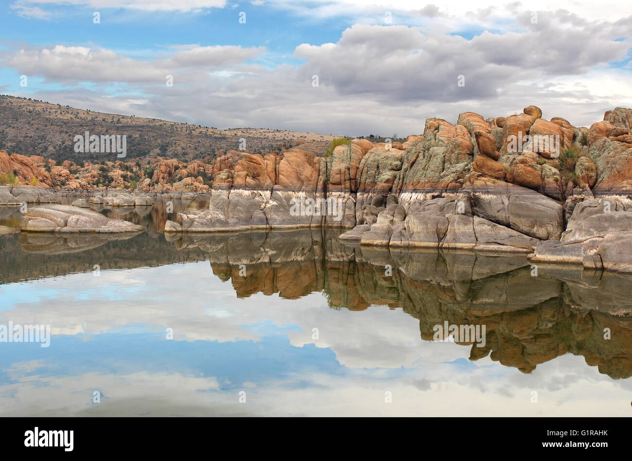Lake with rocks - Dramatic sky and large boulders in quite peaceful ...