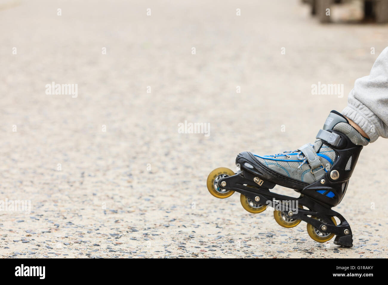 Closeup of woman girl with roller skates blades outdoor Stock Photo - Alamy