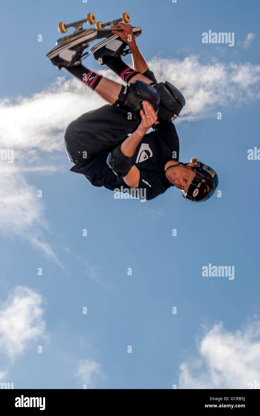 Professional skateboarder Tony Hawk demonstrating moves on the seafront ...