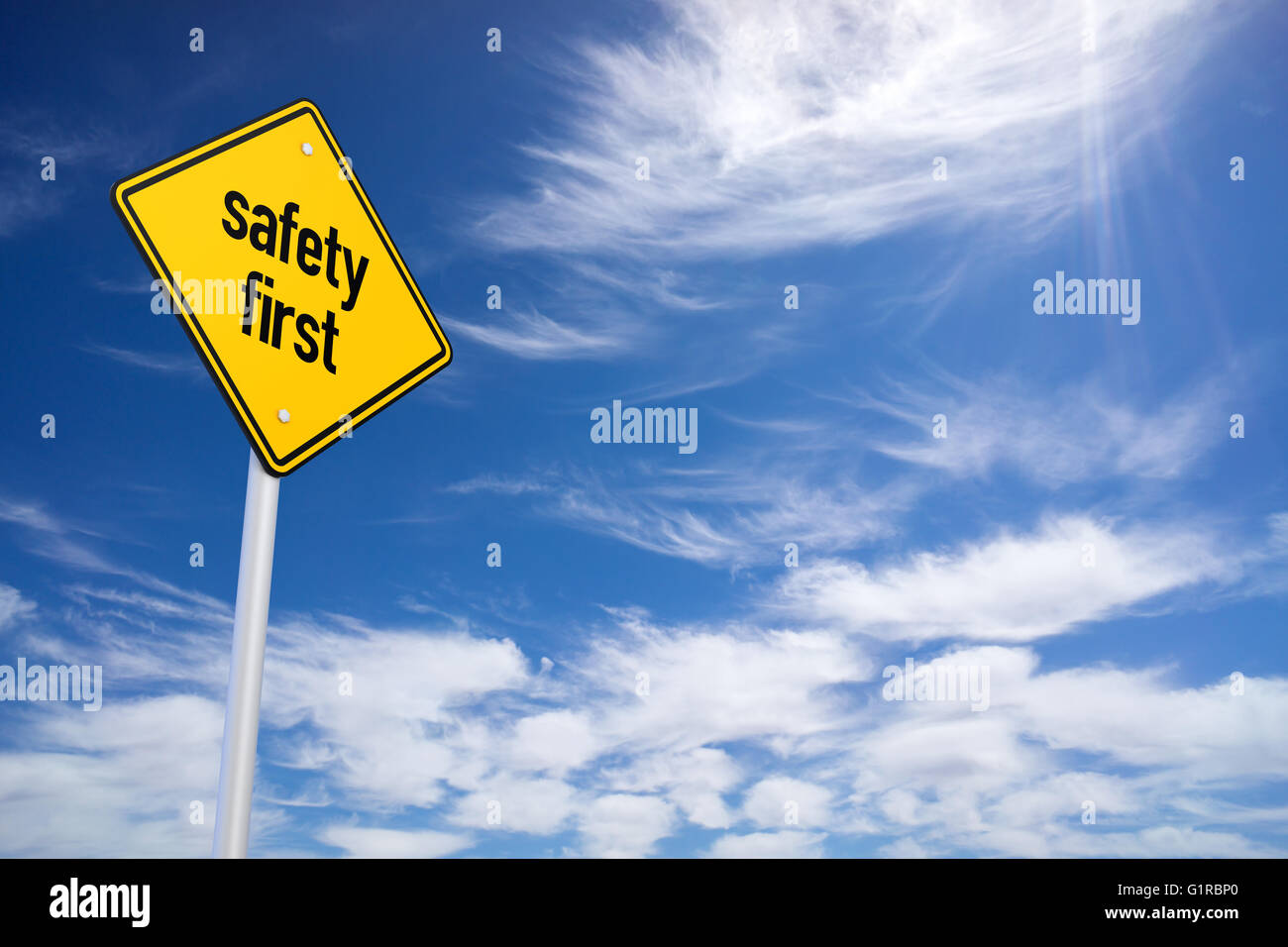 Safety First Road Sign and Blue Sky Stock Photo - Alamy