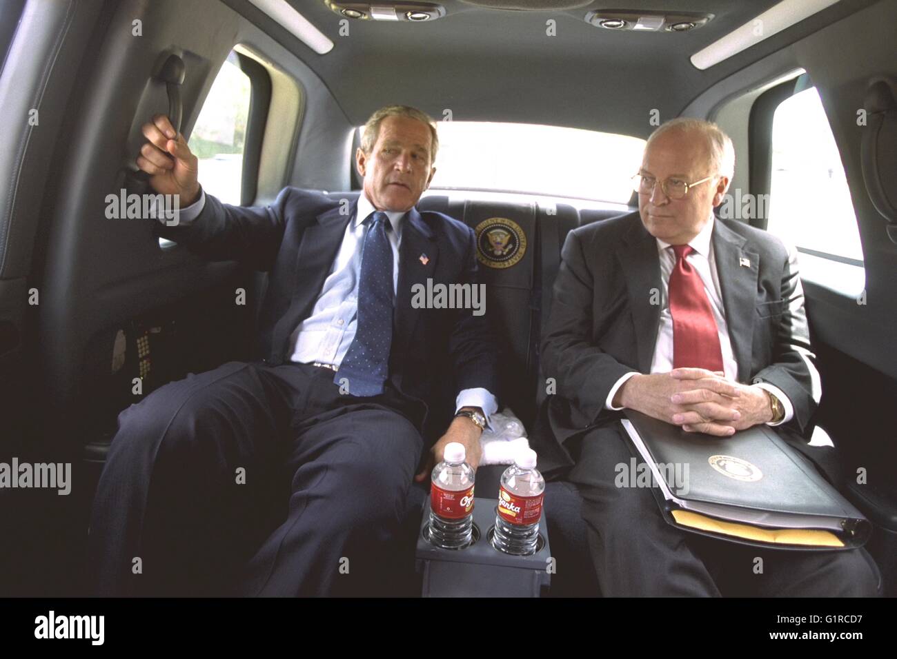 U.S President George W. Bush rides in the presidential limousine with ...