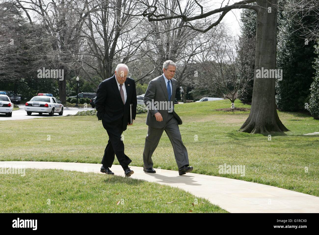 U.S President George W. Bush walks with Vice President Dick Cheney to ...