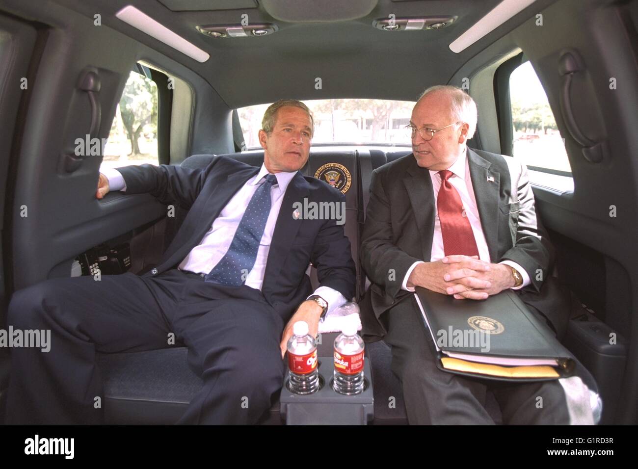U.S President George W. Bush rides in the presidential limousine with ...