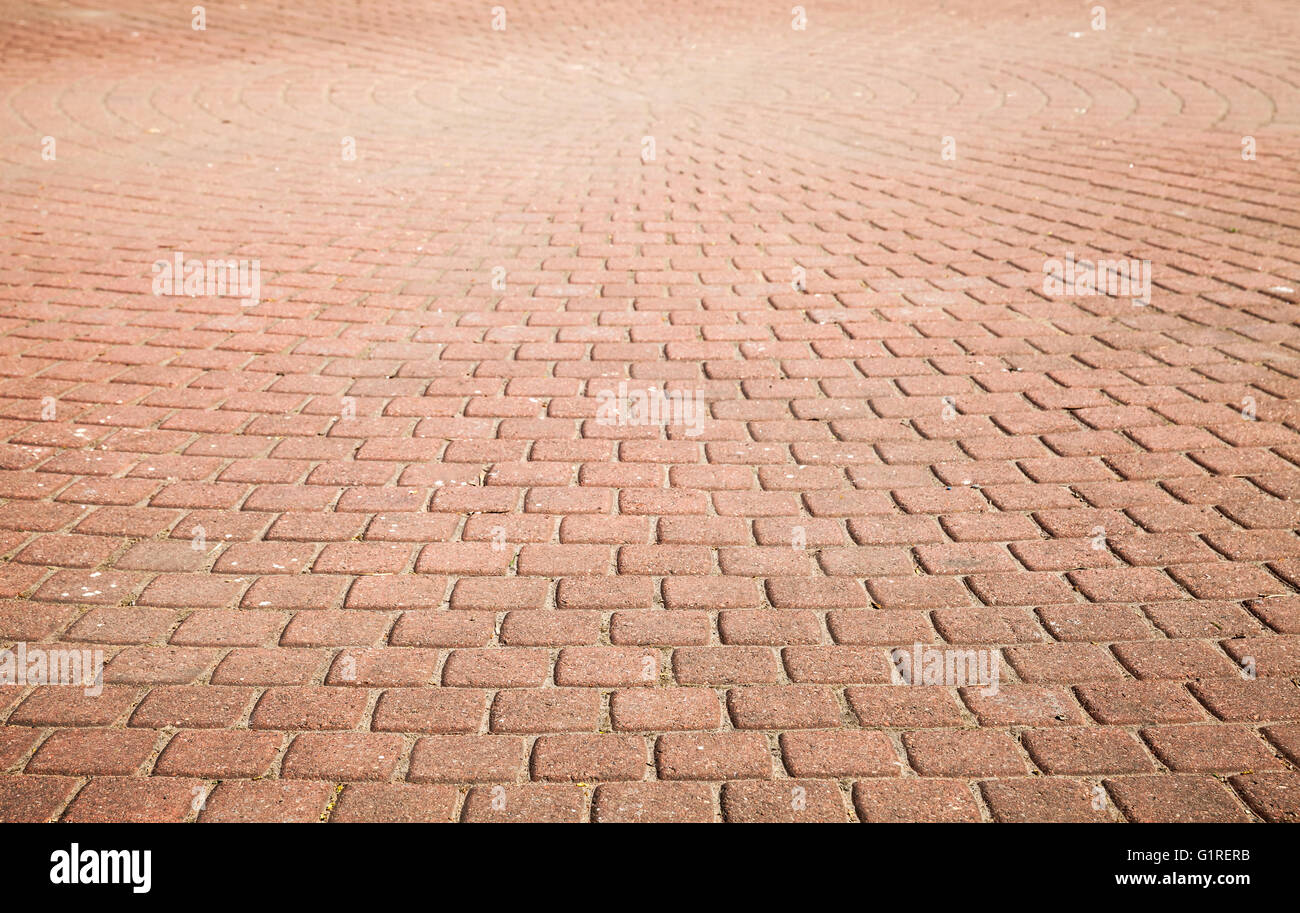 Modern red cobblestone pavement, background photo with selective focus ...