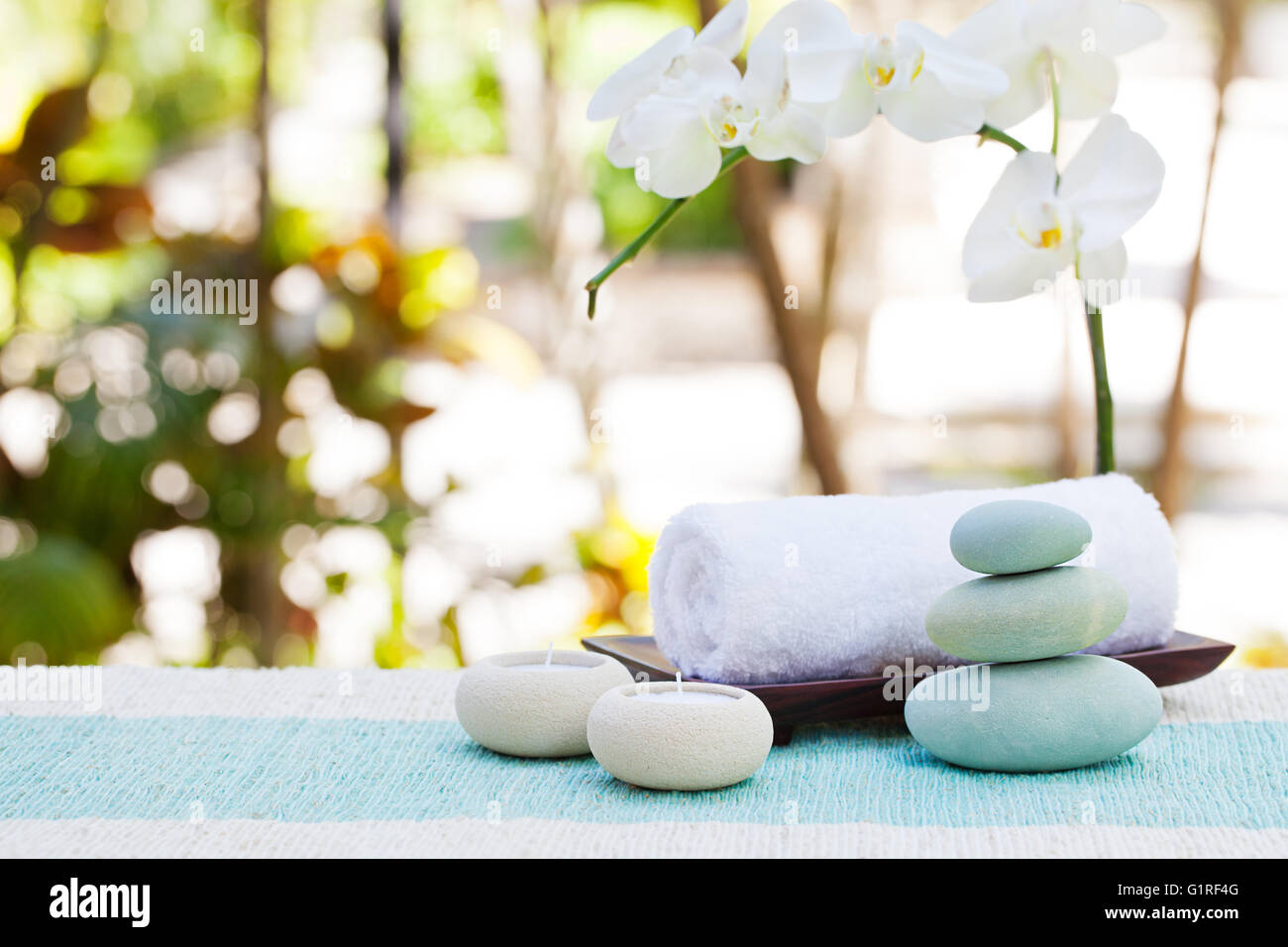 Spa and wellness massage setting Still life with candle, towel and ...