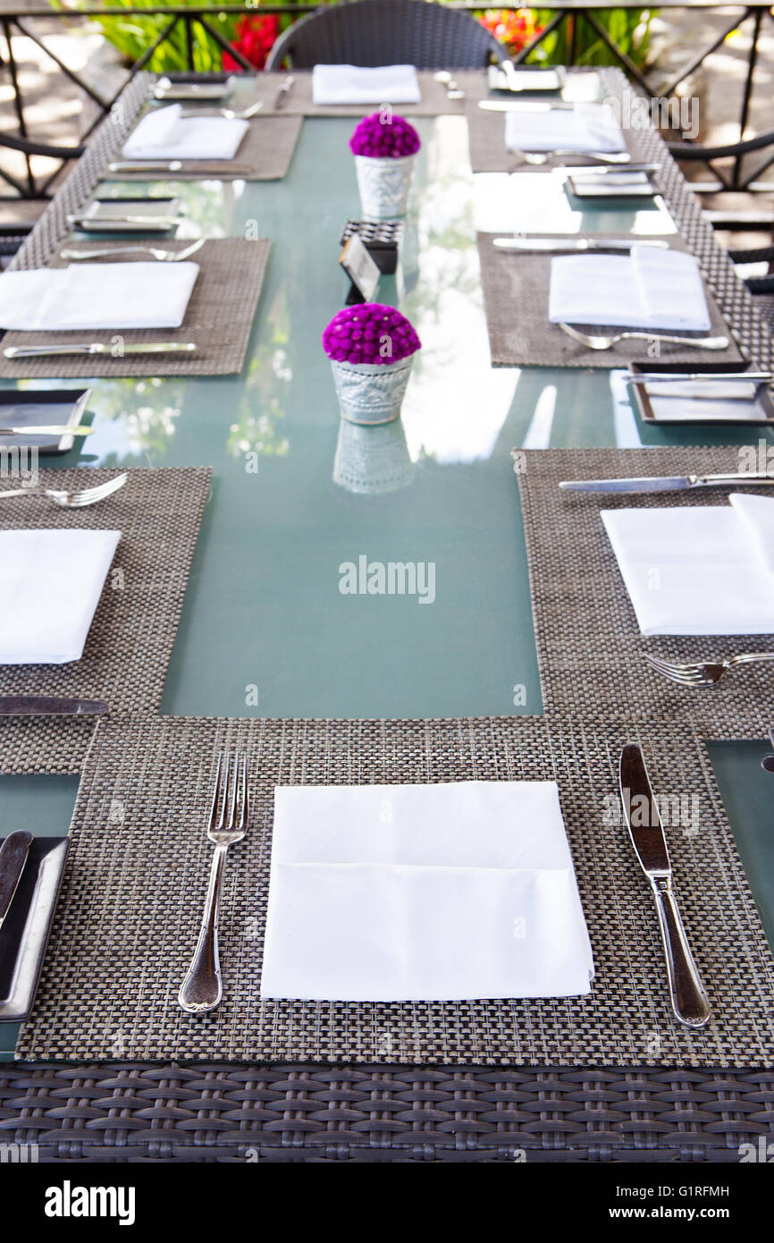 Restaurant table setting Copy space Outdoor summer tropical background ...