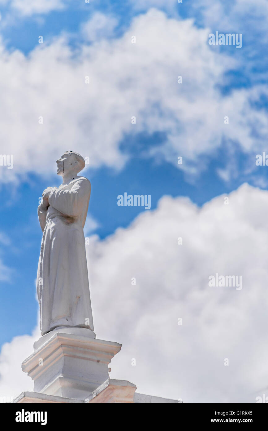 Low angle view of religious man statue at historic center of Quito in ...
