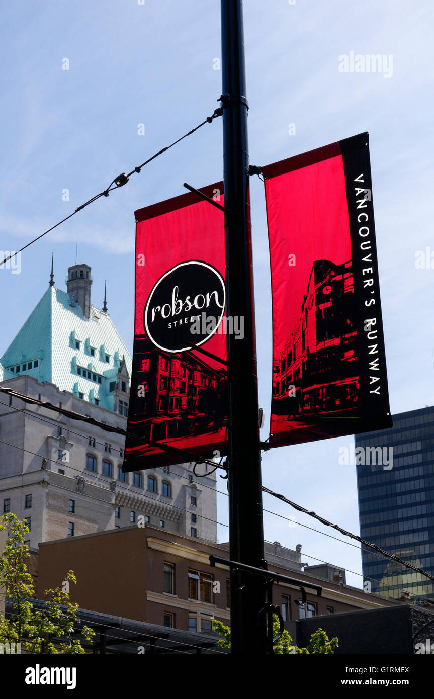 Banners hanging from a lamp post on Robson Street in downtown Vancouver ...