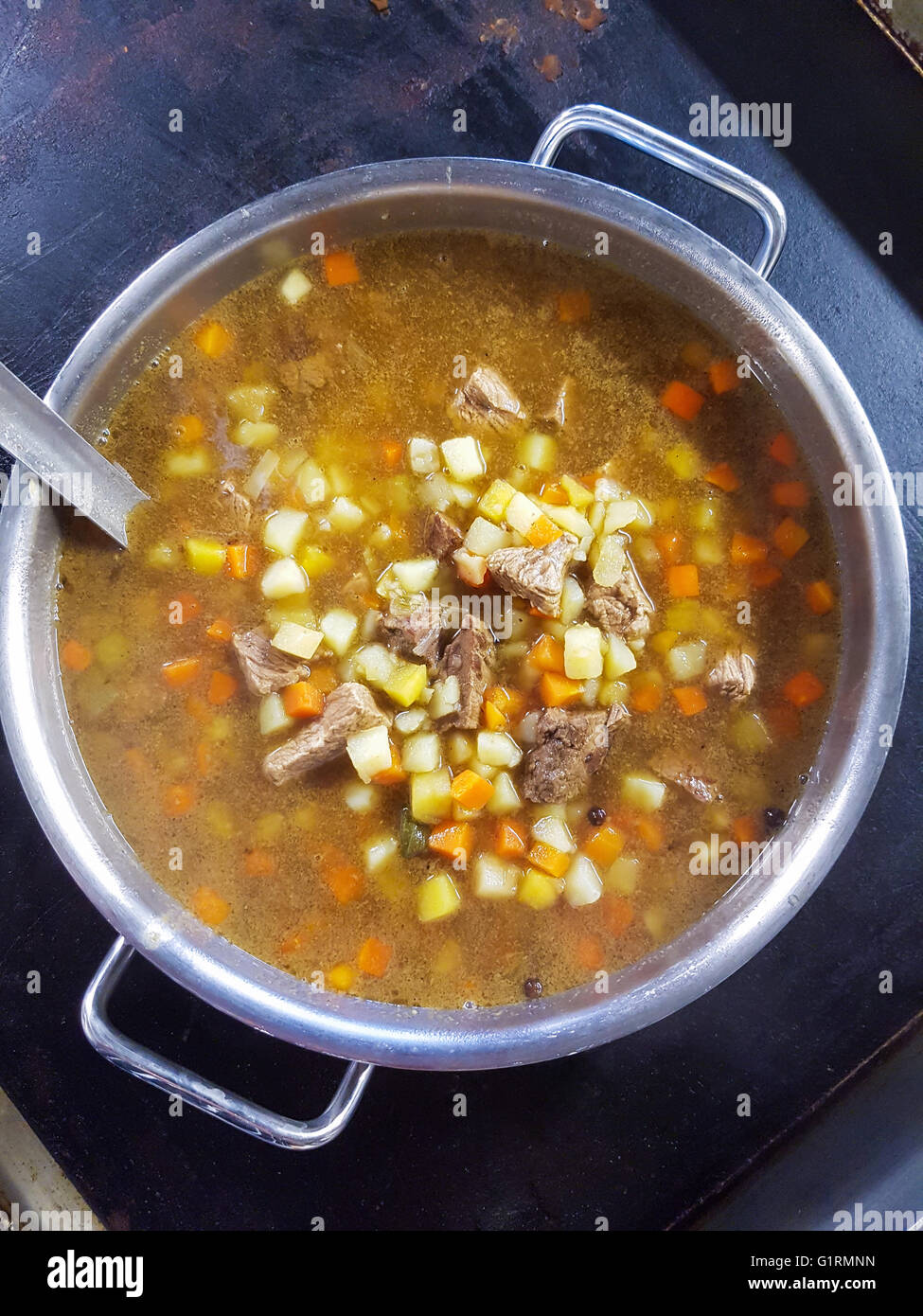 Pot full of traditional, homemade meat soup, at a restaurant Stock ...