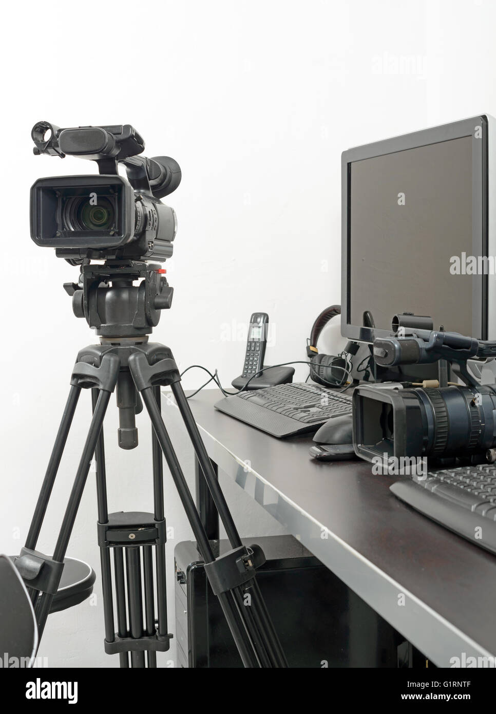 a professional video camera and computer for edition Stock Photo - Alamy