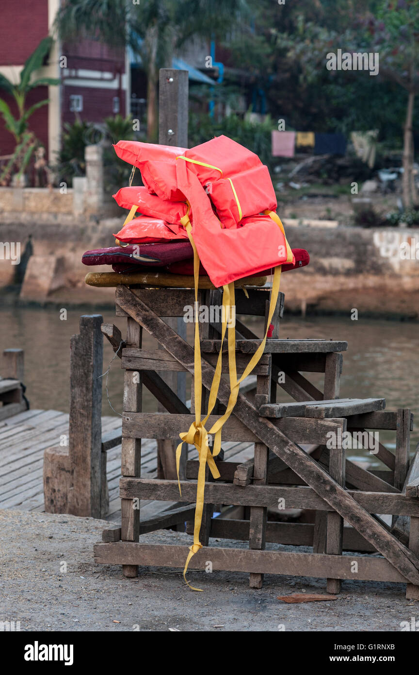 A red lifejacket on the wooden staircase in front of the Inle lake in ...