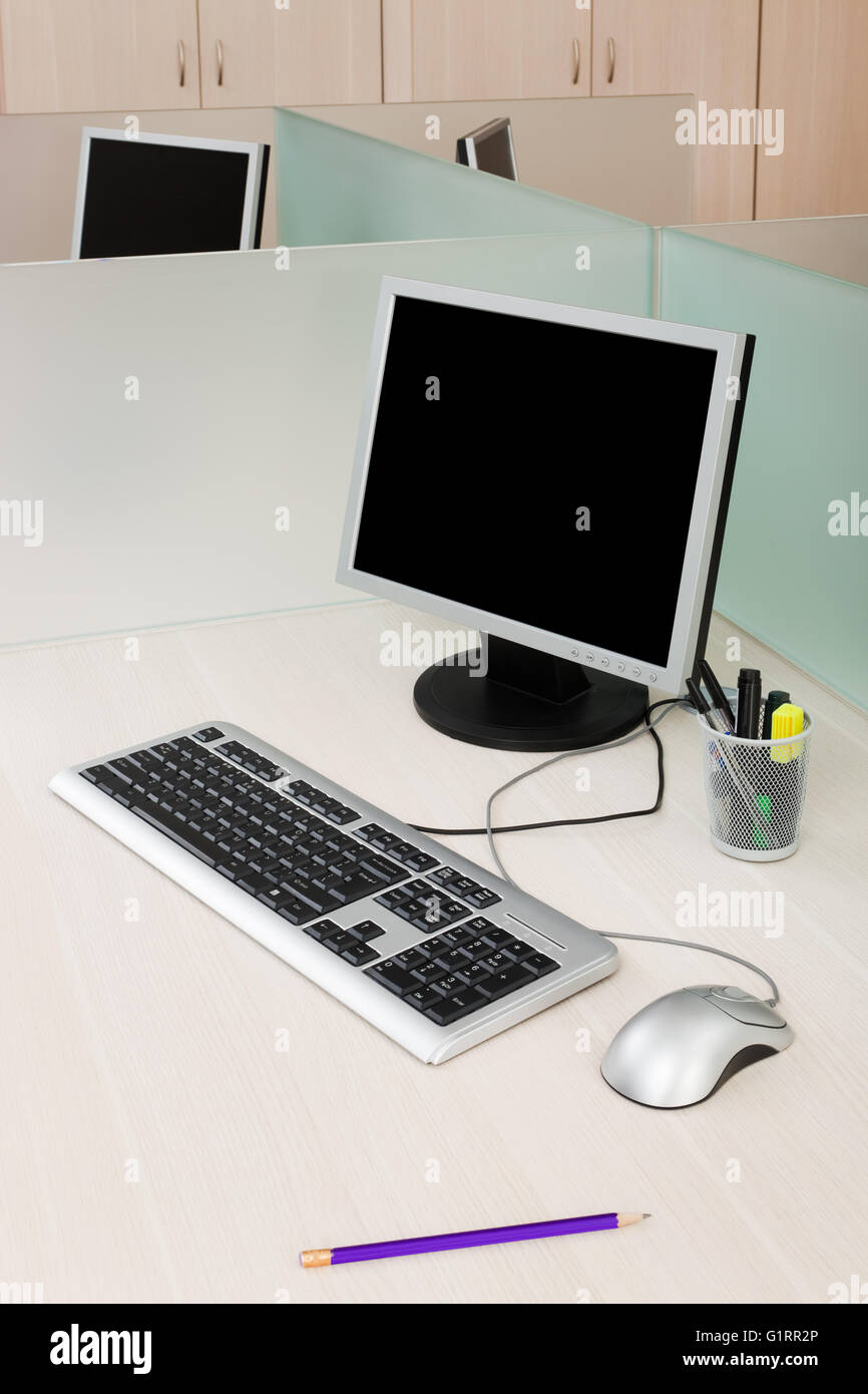 computers on a desk in a modern office Stock Photo - Alamy