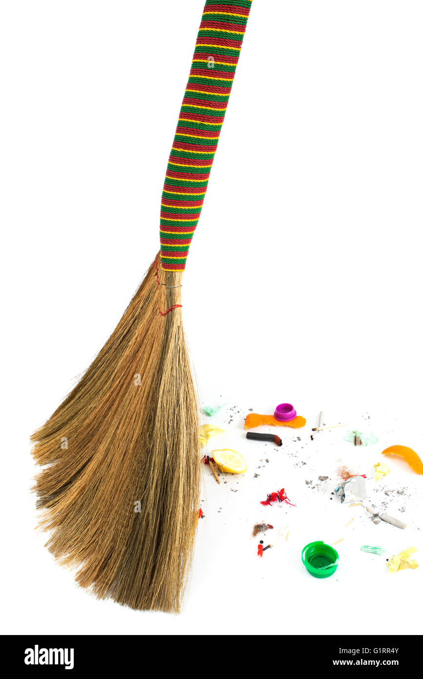 a new broom sweeping various debris and mud Stock Photo - Alamy