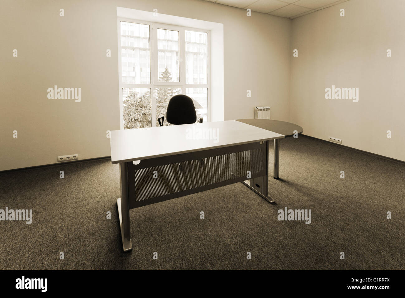 Chair and table at a window at modern office Stock Photo - Alamy