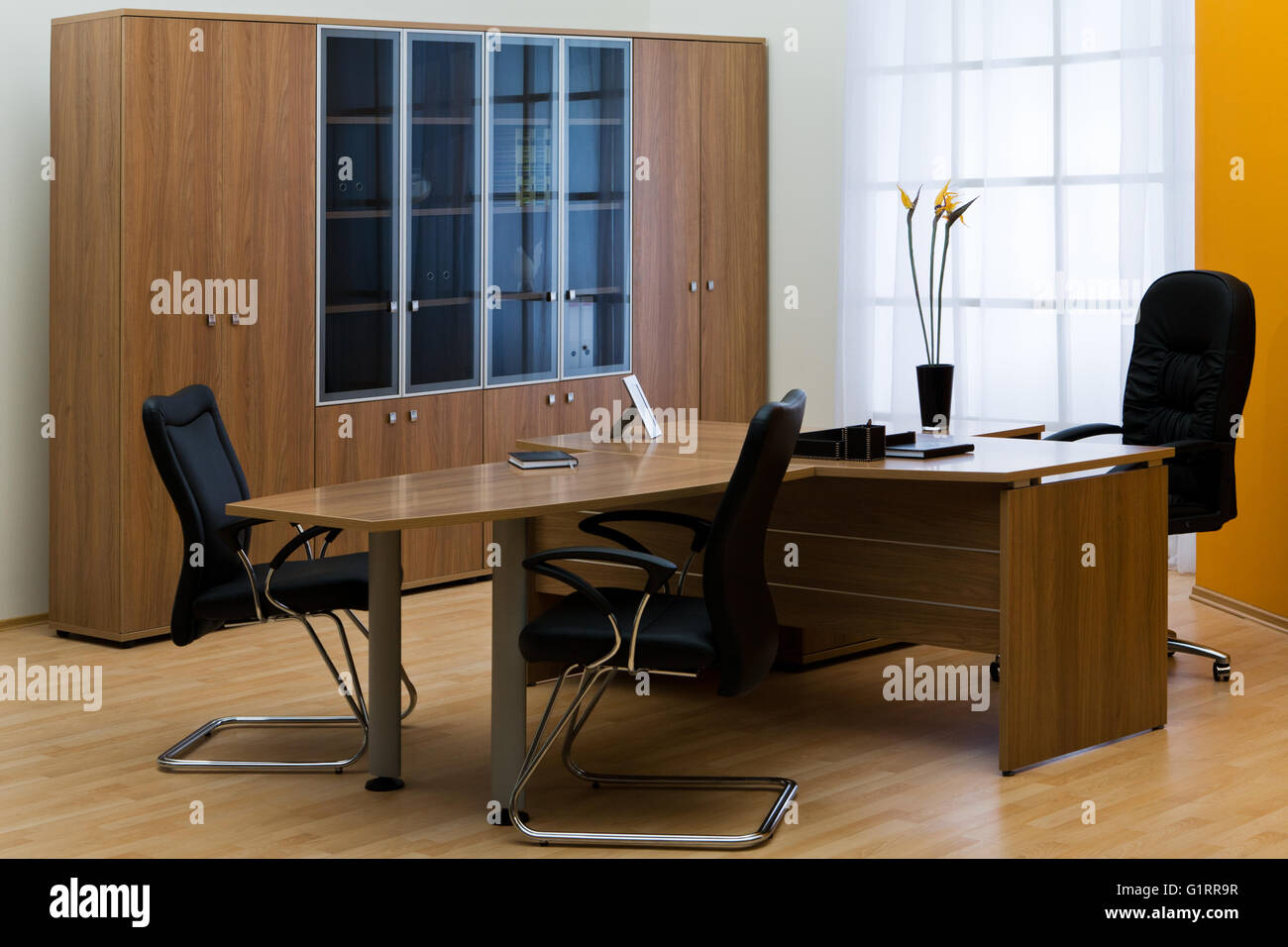 large wooden desk in a modern office Stock Photo - Alamy