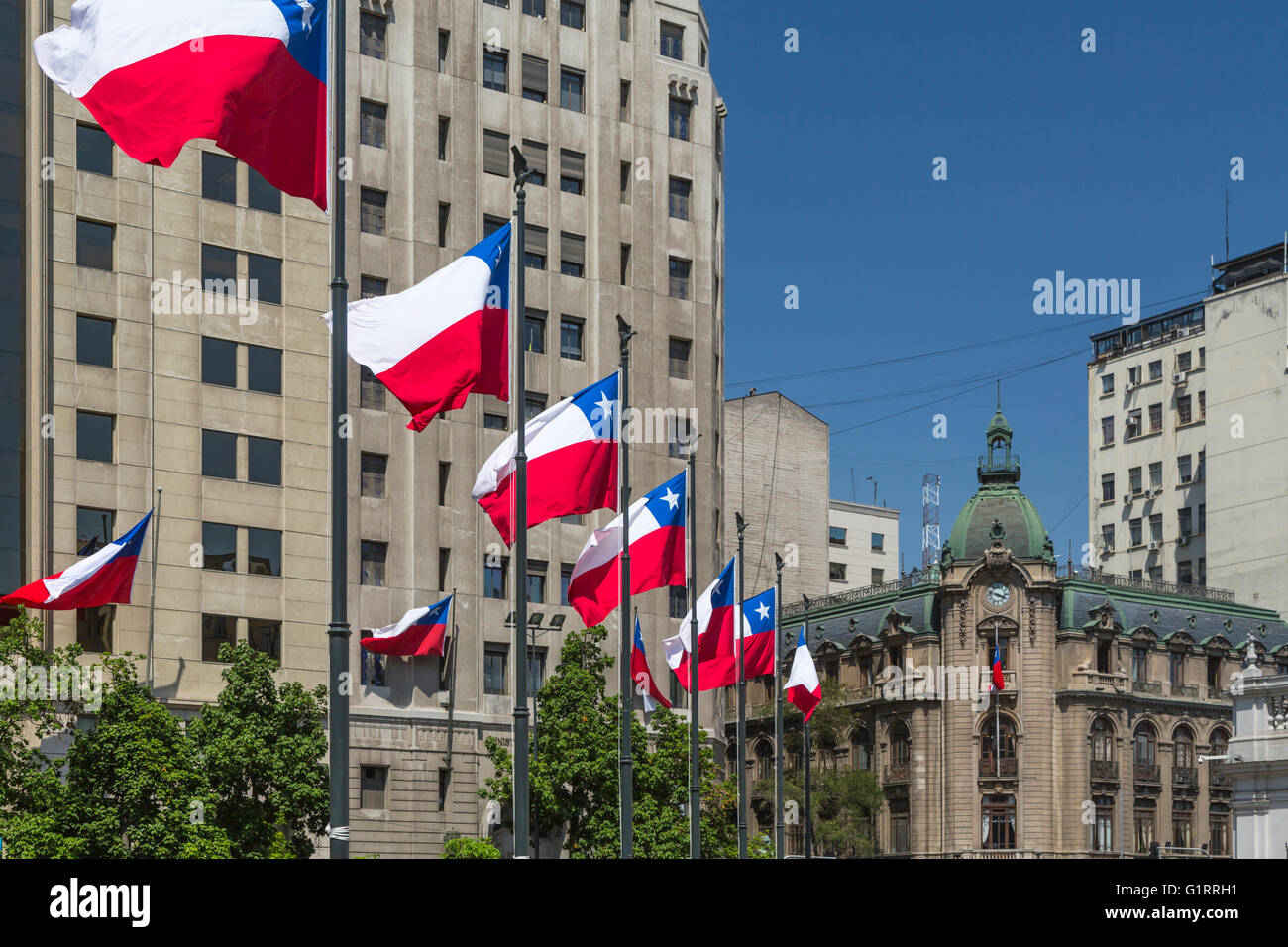 Chilean flags flying in the Plaza de la Constitucion in Santiago, Chile ...