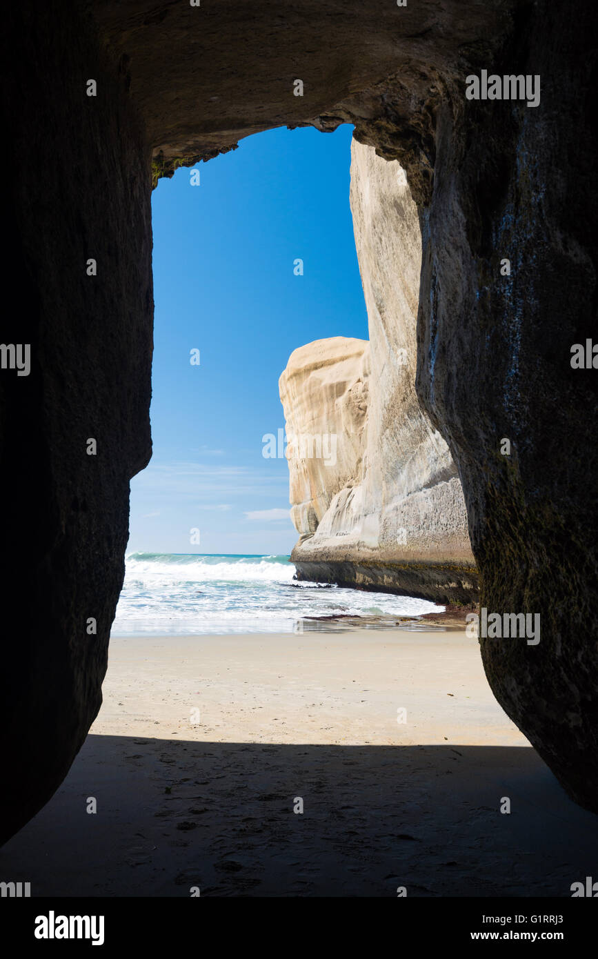 Small cave at the Tunnel beach near Dunedin, New Zealand Stock Photo ...