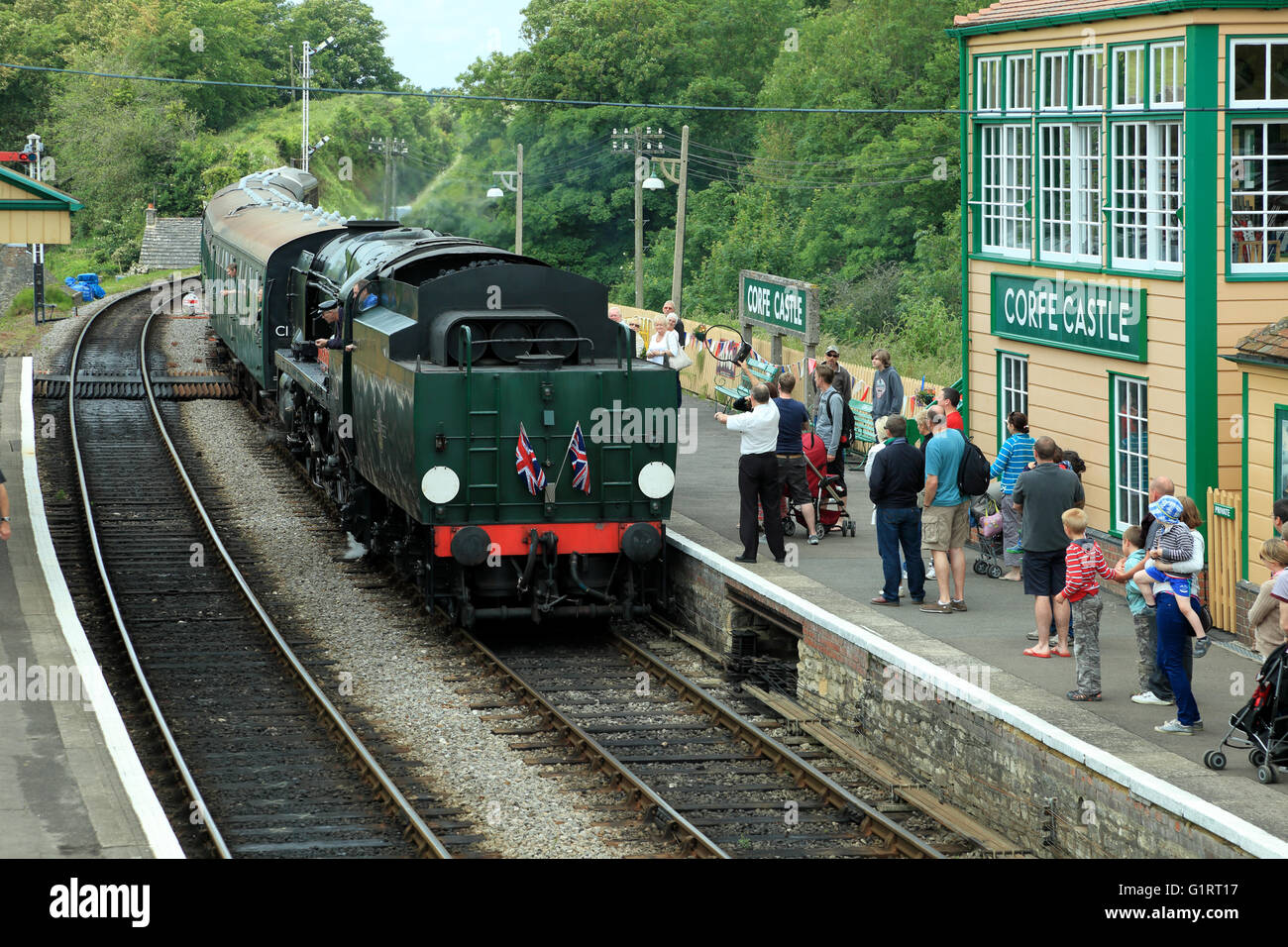 Steam Train arriving at Corfe Castle railway station with passengers ...