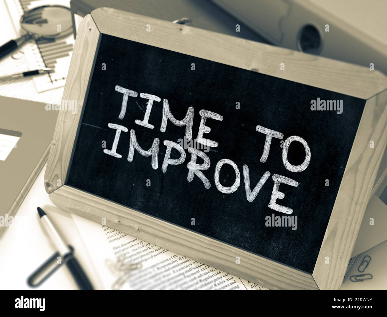 Hand Drawn Time to Improve Concept on Small Chalkboard Stock Photo - Alamy