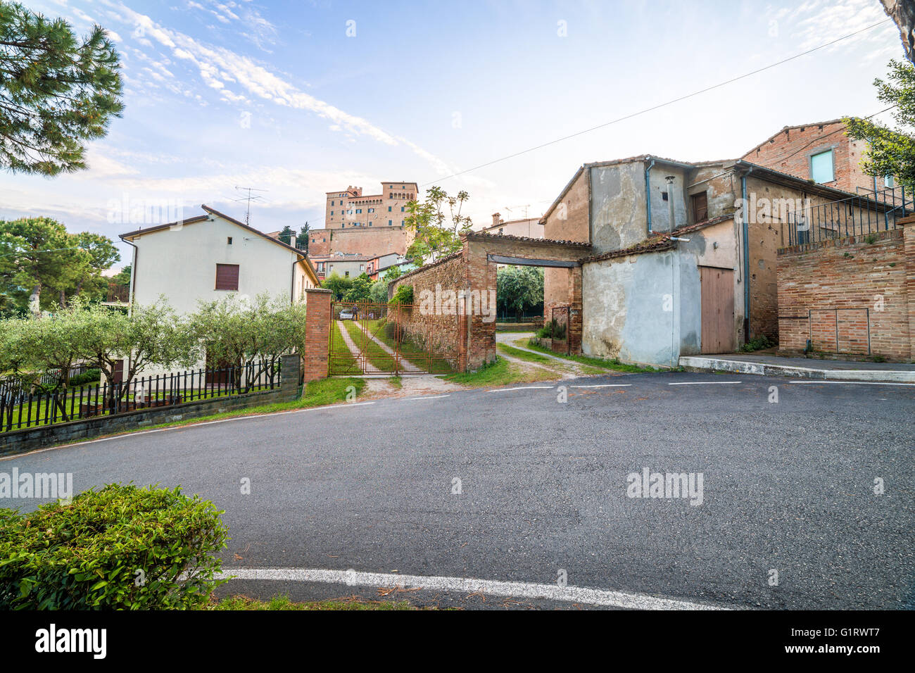 castle overlooking the streets of a small hilltop village in Emilia ...