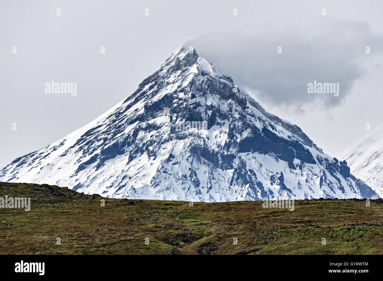 Mountain landscape of Kamchatka: view of the cone of the Kamen Volcano ...