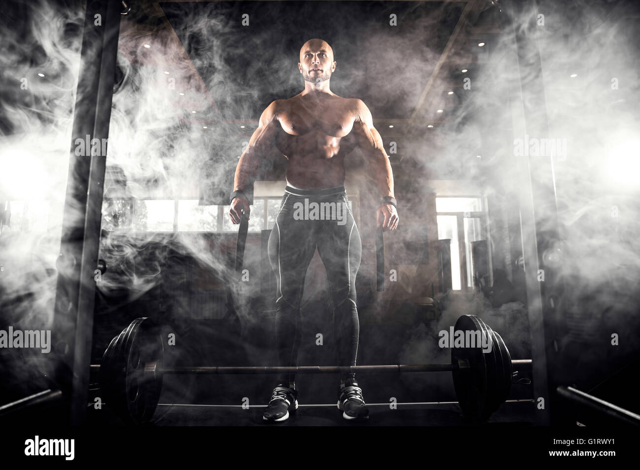 Bodybuilder preparing for deadlift of barbell Stock Photo - Alamy
