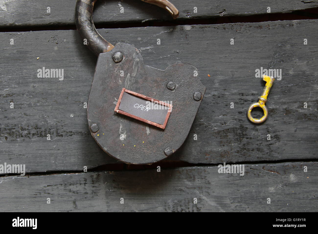 Open sign and old padlock Stock Photo - Alamy