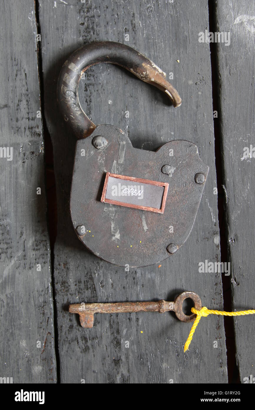 Open sign and old padlock Stock Photo - Alamy