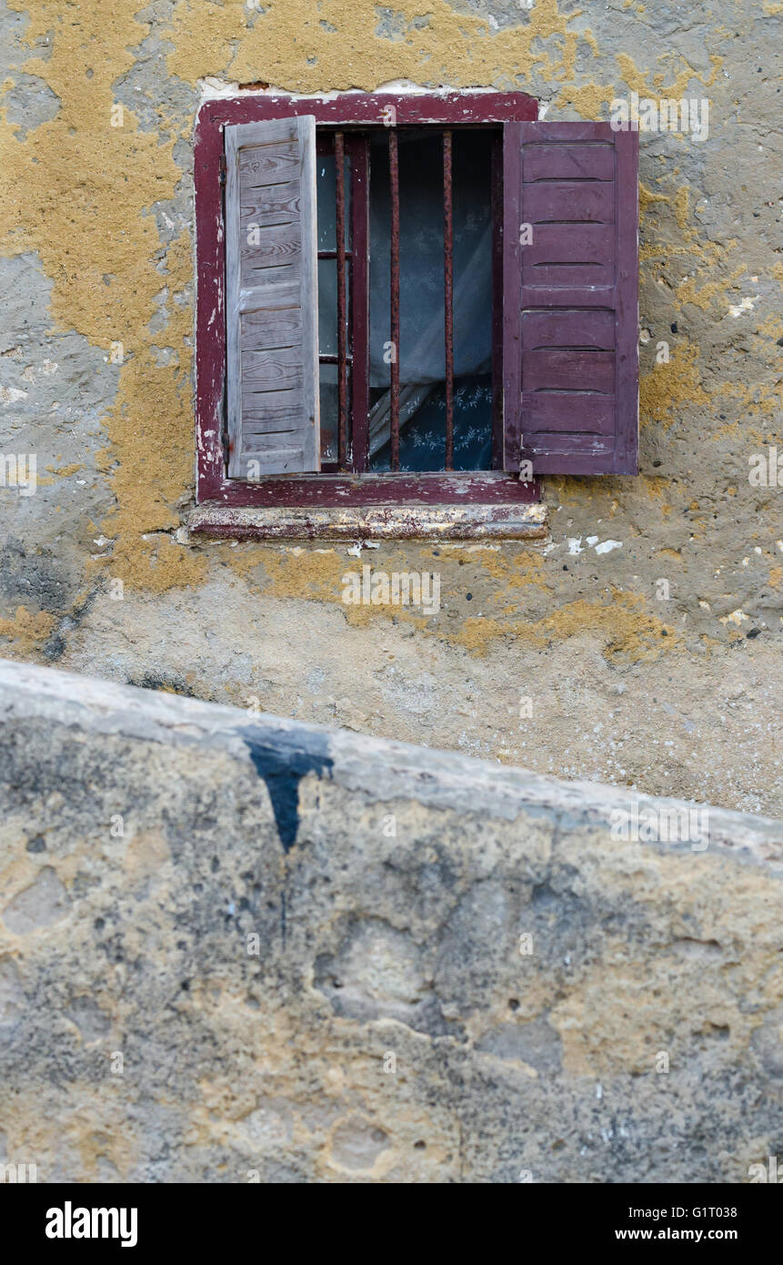 Old dirty window with magenta wooden shutters on old dirty wall Stock ...