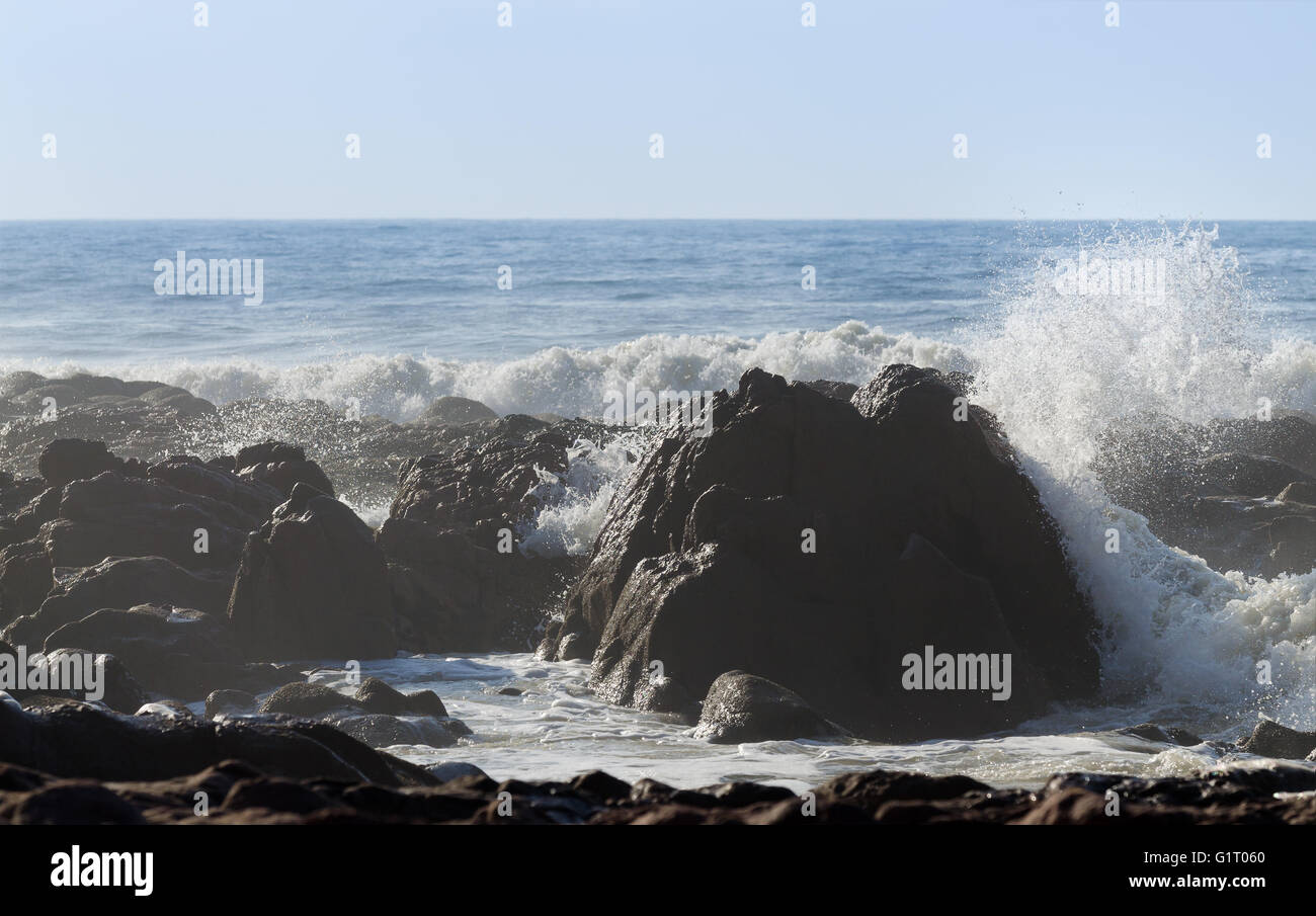 Beautiful beach landscape with big red rocks Stock Photo - Alamy