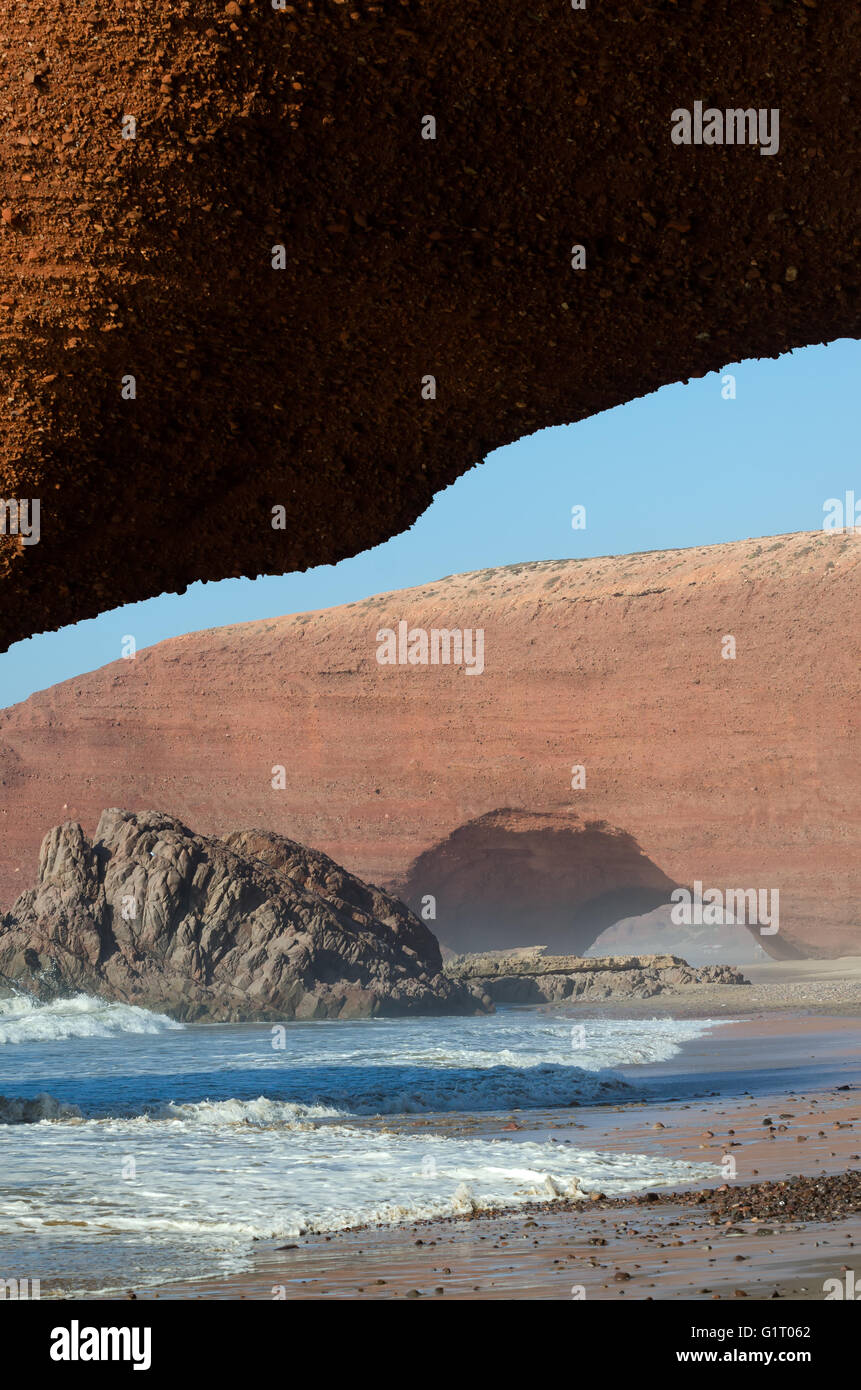 Red arch on atlantic ocean coast in Marocco, Legzira beach Stock Photo ...